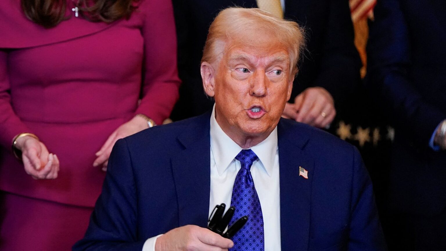 Trump reacts after Reporter hits him on the face with microphone