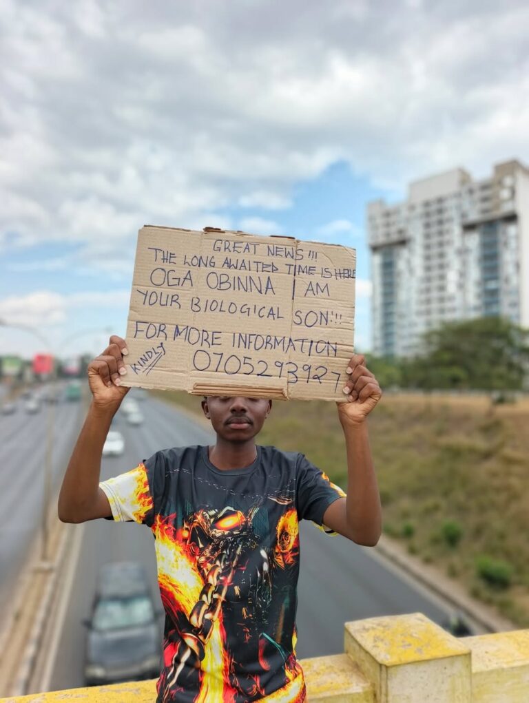 Young man in Nairobi holds placard claiming to be Oga Obinna's ...